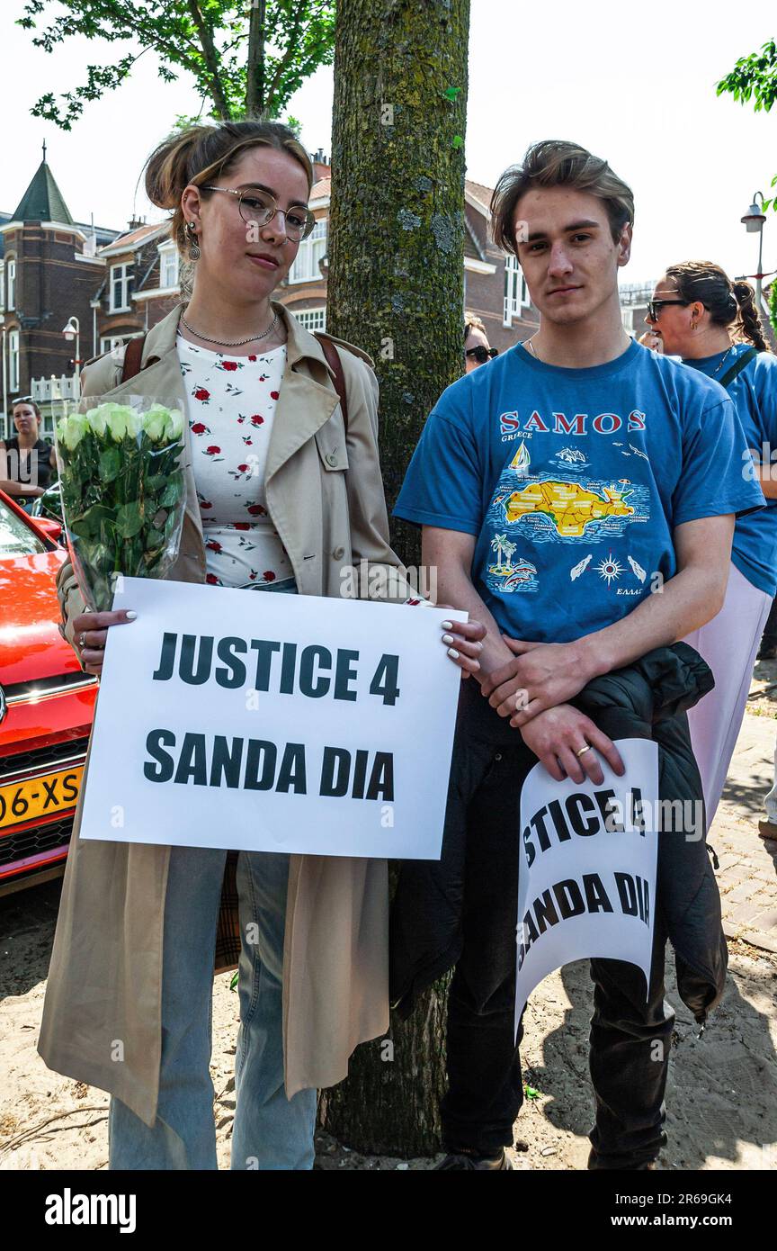 Protesters hold placards during the Sanda Dia protest Black Lives ...