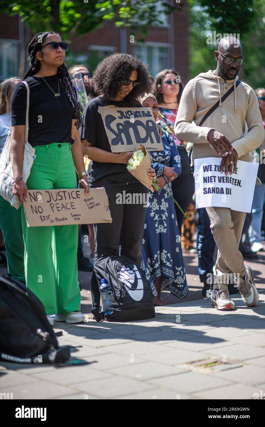 Protesters hold placards during the Sanda Dia protest Black Lives ...