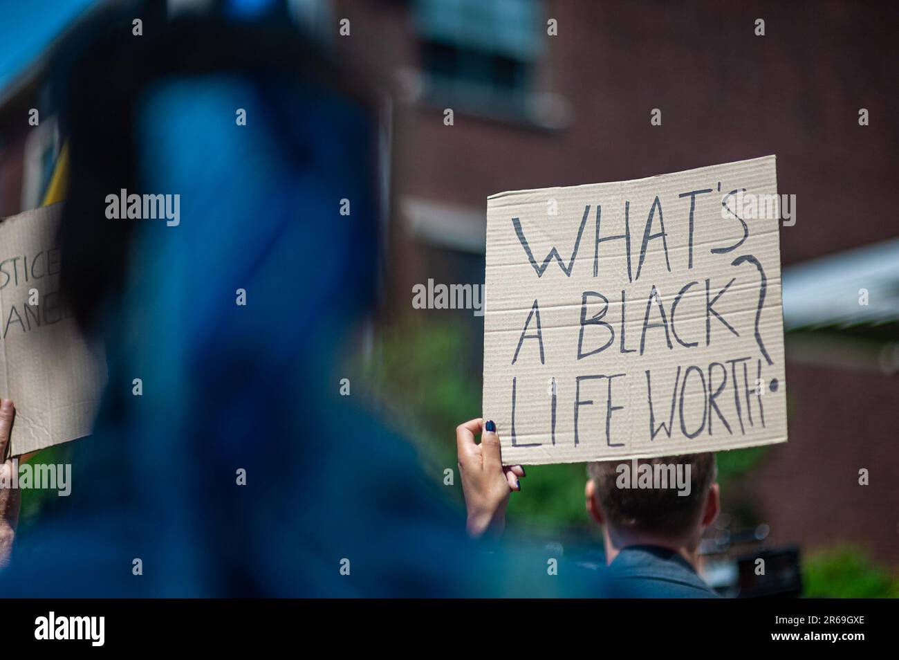 The Hague, 07/06/2023, A protester holds a placard during the Sanda Dia ...