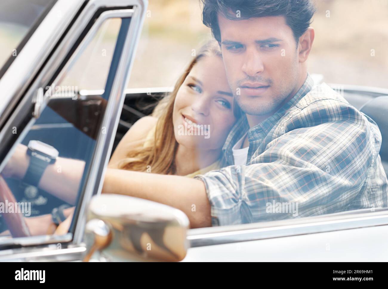 Our relaxing Sunday drive. a young couple riding in a sports car Stock ...
