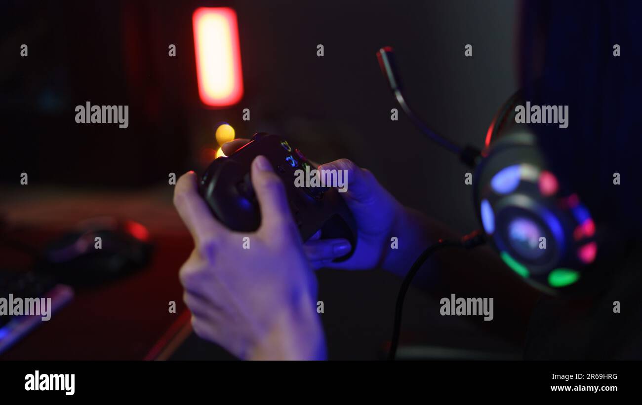 Female cyber hacker gamer using controller joystick to playing or ...