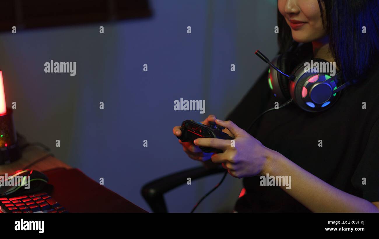 Female cyber hacker gamer using controller joystick to playing or ...