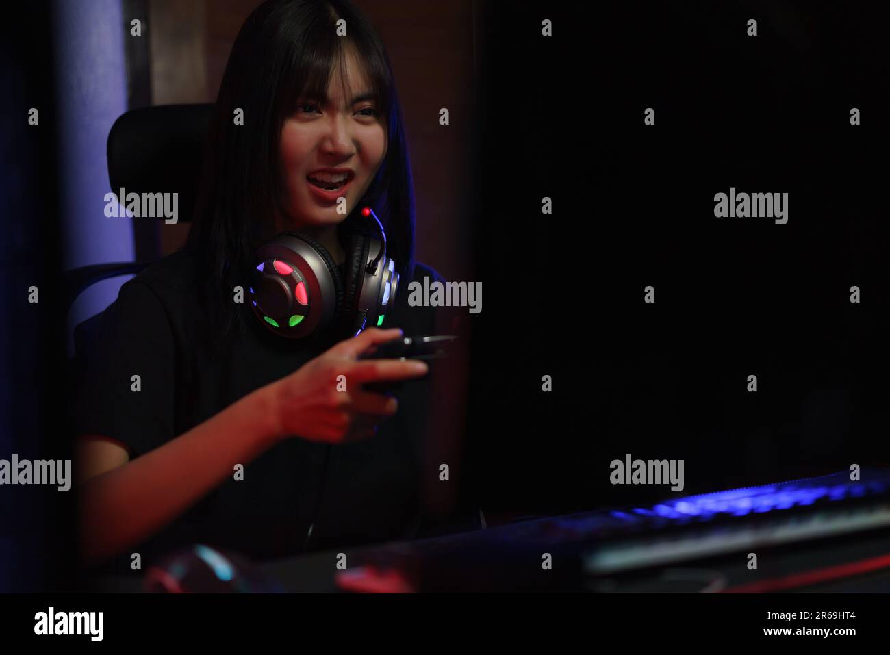 Female cyber hacker gamer using controller joystick to playing games on ...