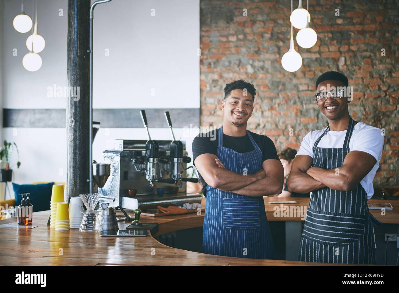 Did someone say coffee. two confident young men working in a cafe Stock ...