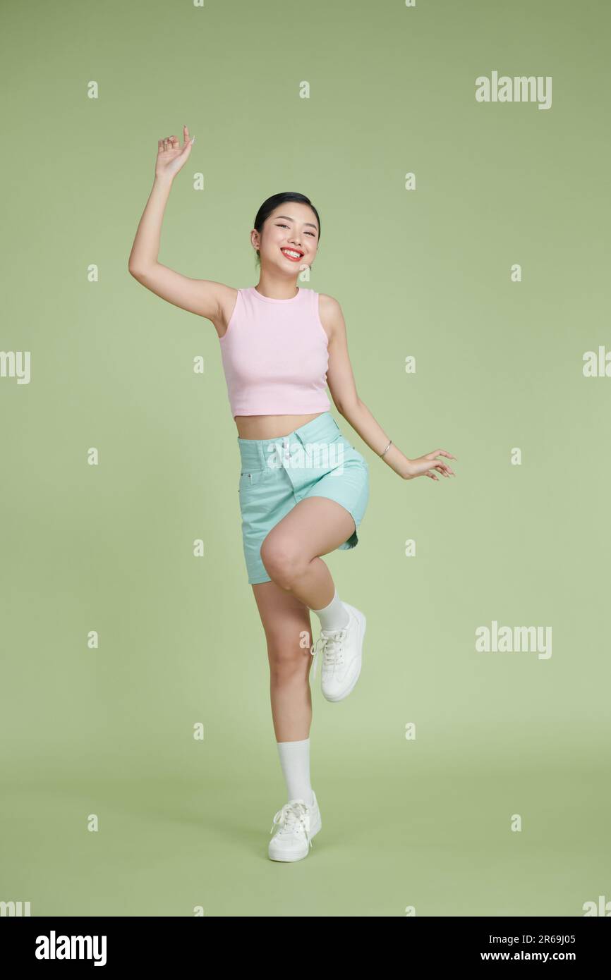 Lovely slim girl posing with sincere smile Stock Photo - Alamy
