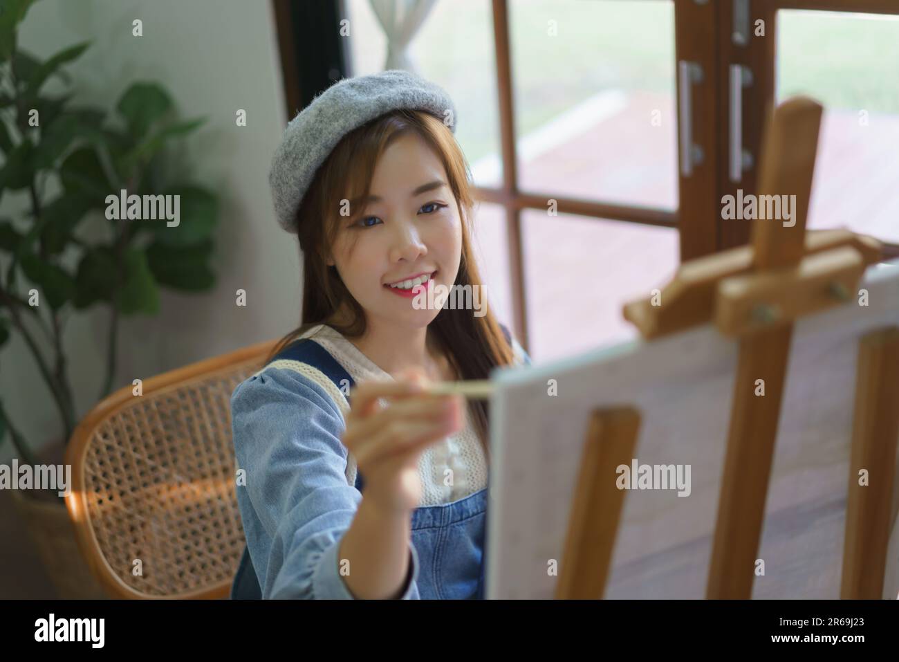 Young female artist is creation to drawing and painting art masterpiece ...