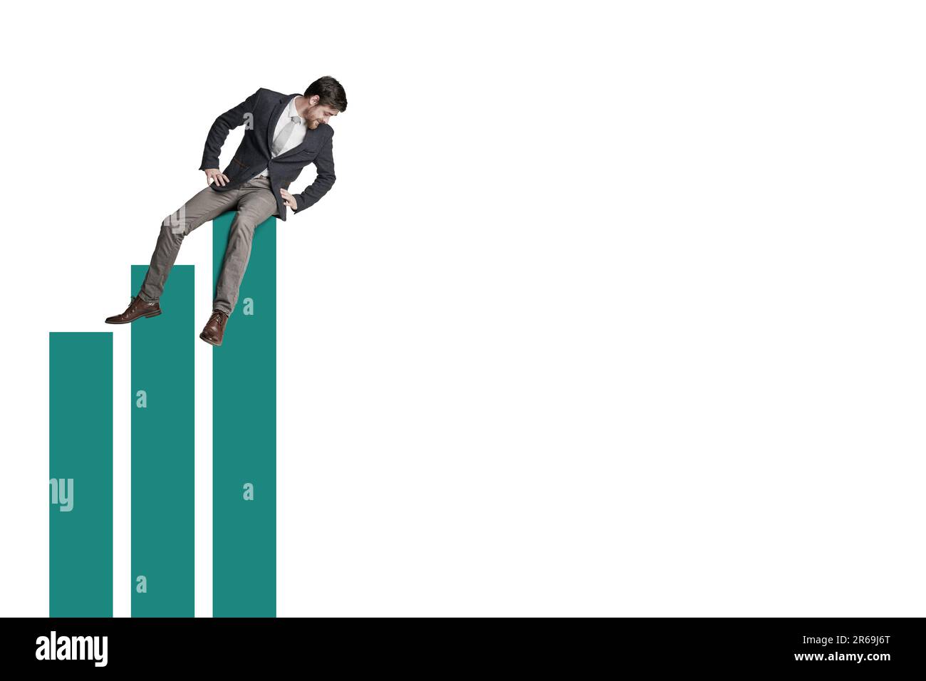 The view is better from the top. a businessman balancing on top of a ...
