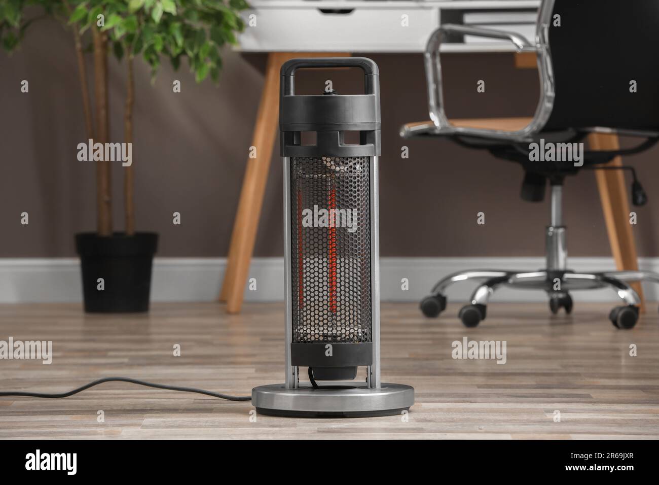 Modern infrared heater on floor in room Stock Photo - Alamy