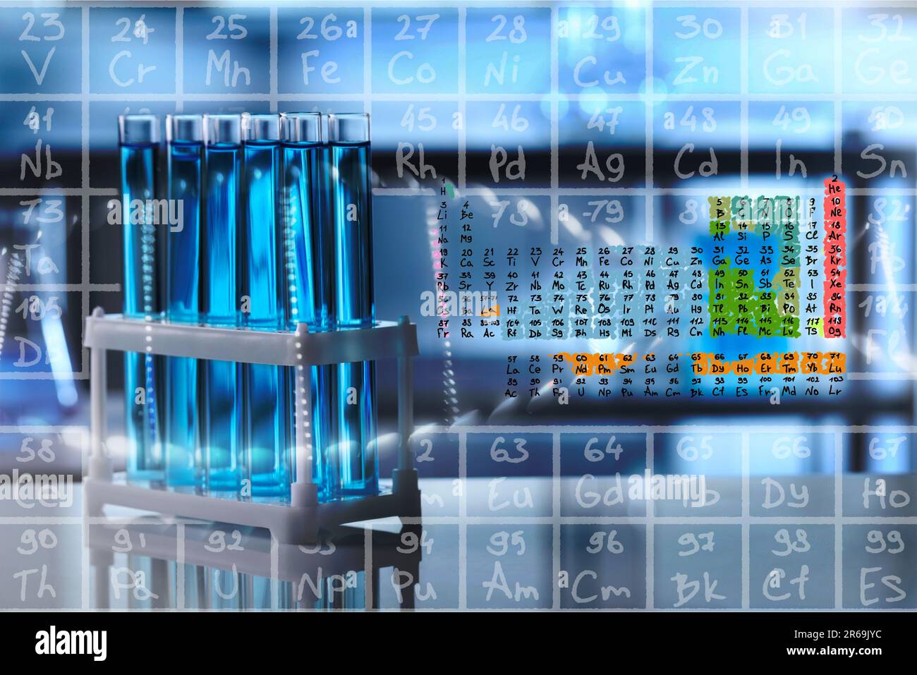 Test tubes with light blue liquid in laboratory and periodic table of ...
