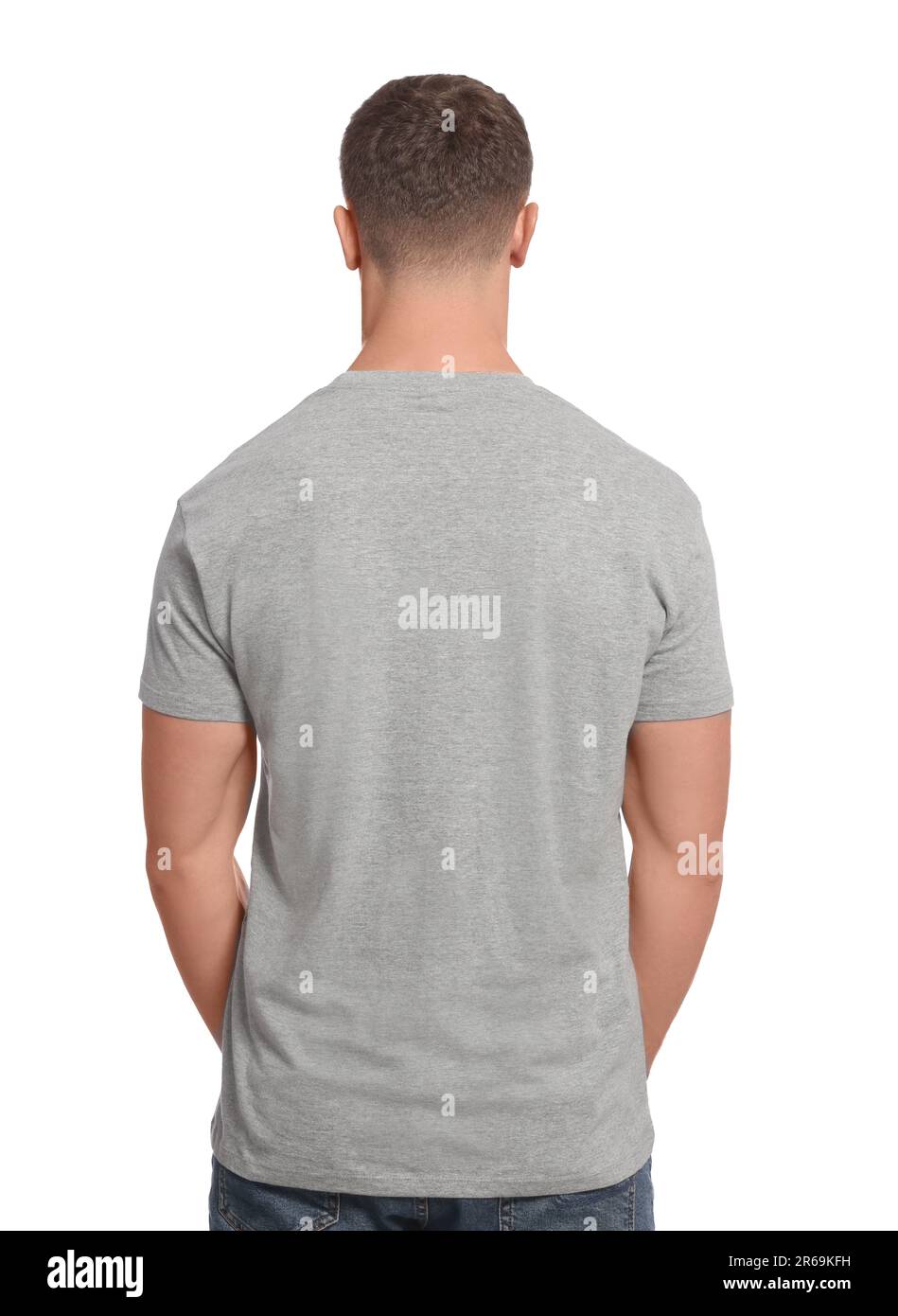 Man wearing grey t-shirt on white background, back view. Mockup for ...