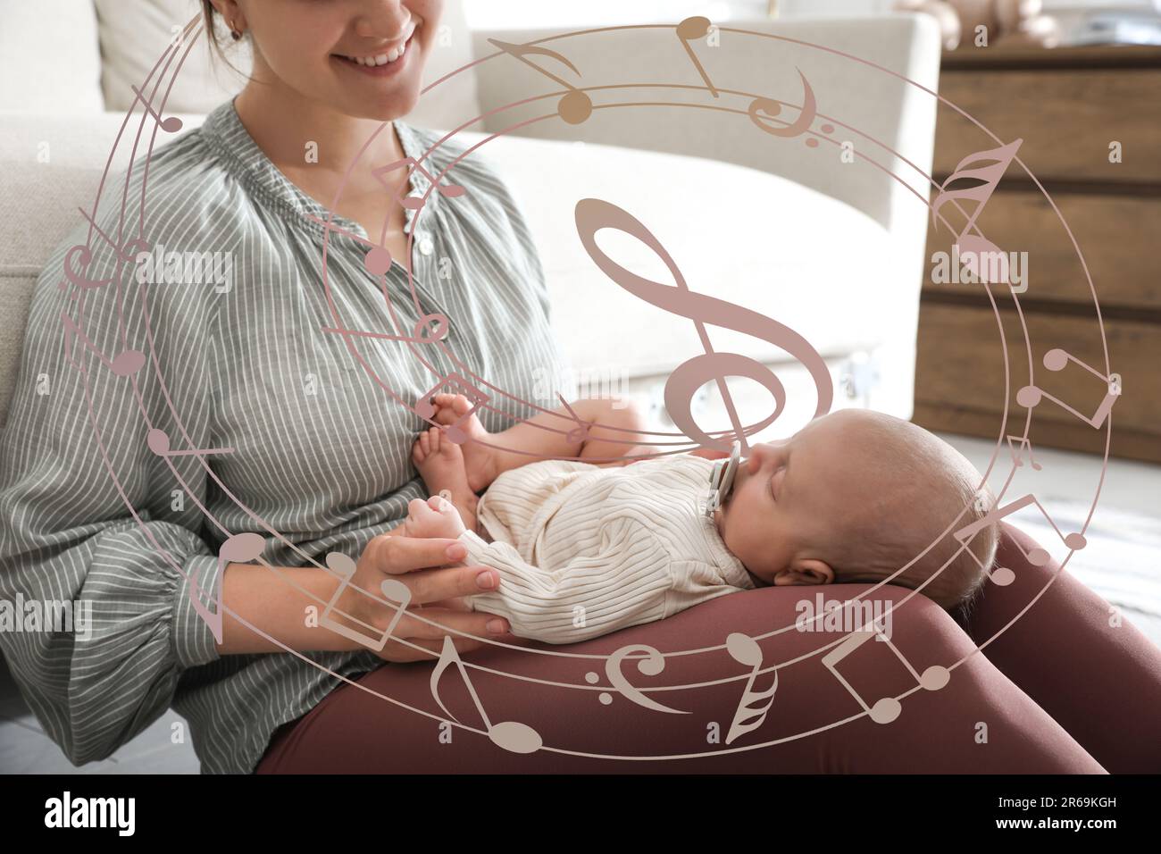 Smiling mother singing lullaby to her baby at home, closeup. Music ...