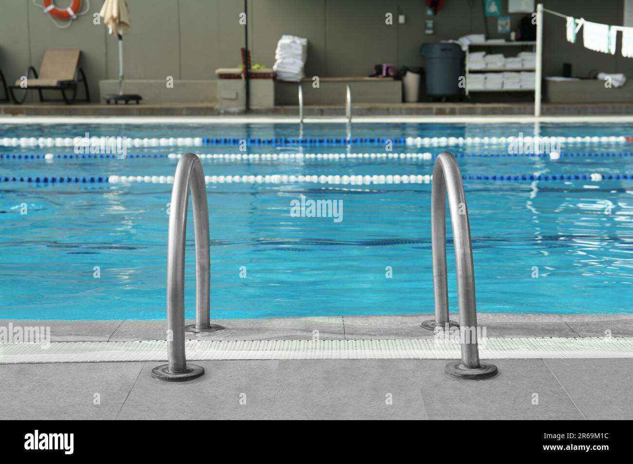Ladder with handrails in outdoor swimming pool Stock Photo - Alamy