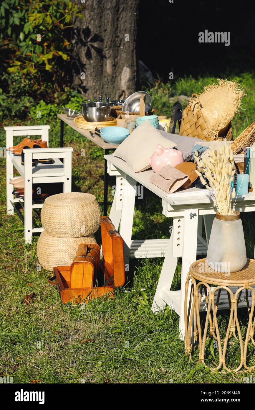 Small tables with many different items on garage sale outdoors Stock ...