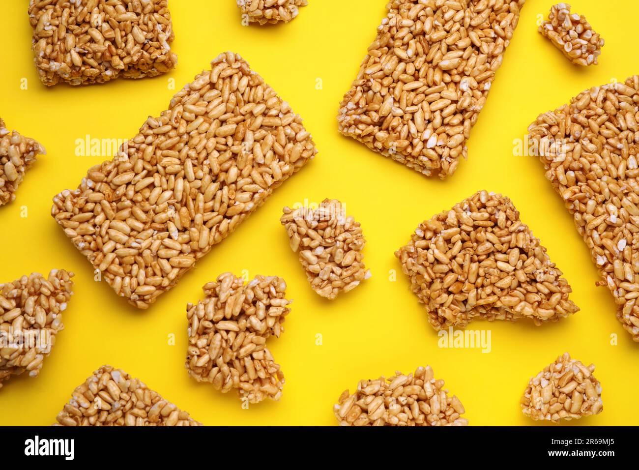 Puffed rice bars (kozinaki) on yellow background, flat lay Stock Photo ...