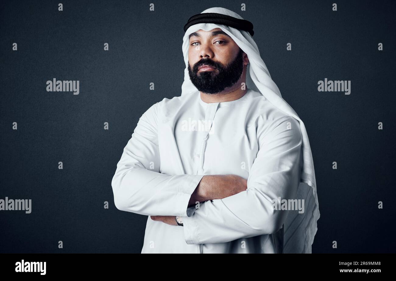 Traditional man thats about his business. Studio shot of a young man ...