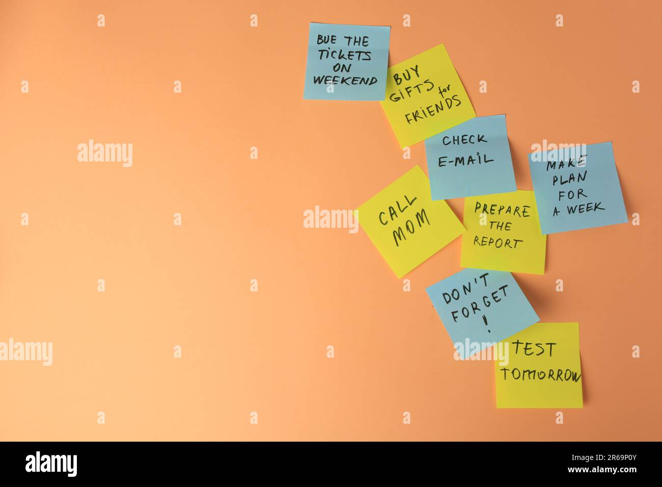 Many different reminder notes on pale orange background. Space for text ...