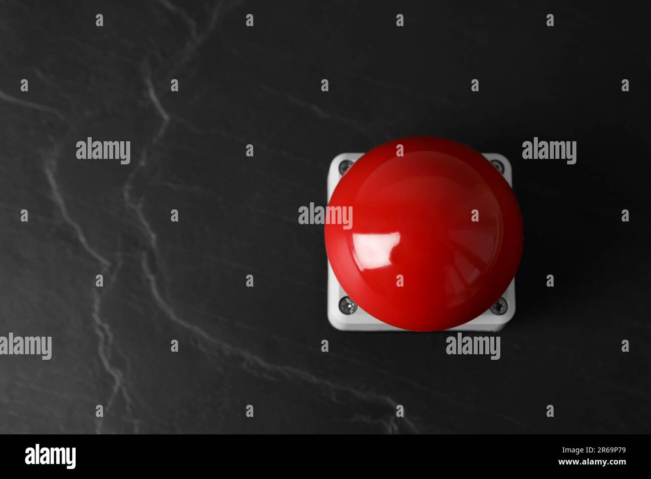 Red button of nuclear weapon on black background, top view with space ...