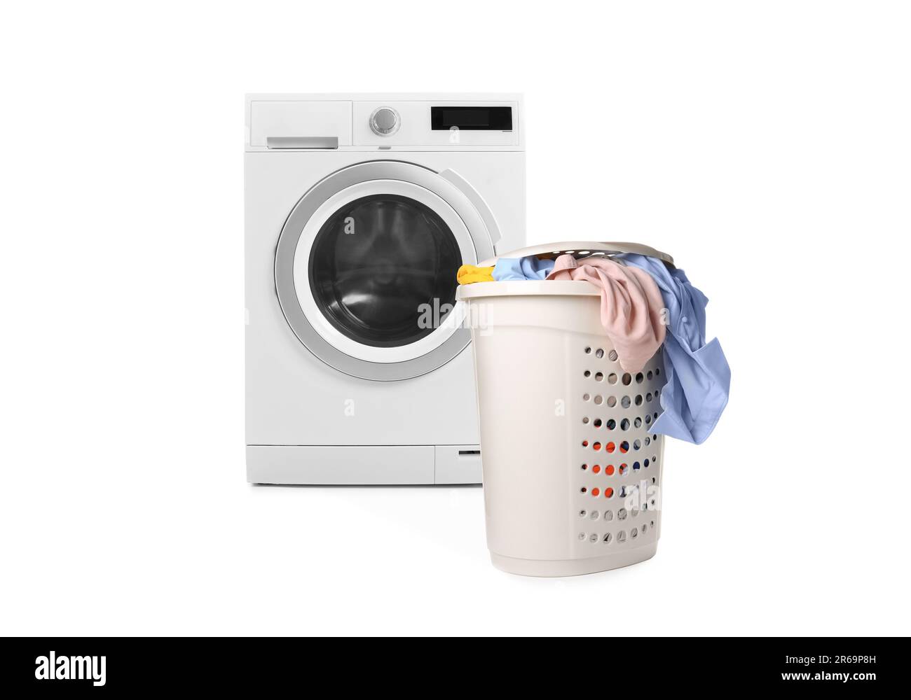 Washing machine and plastic laundry basket full of clothes on white ...