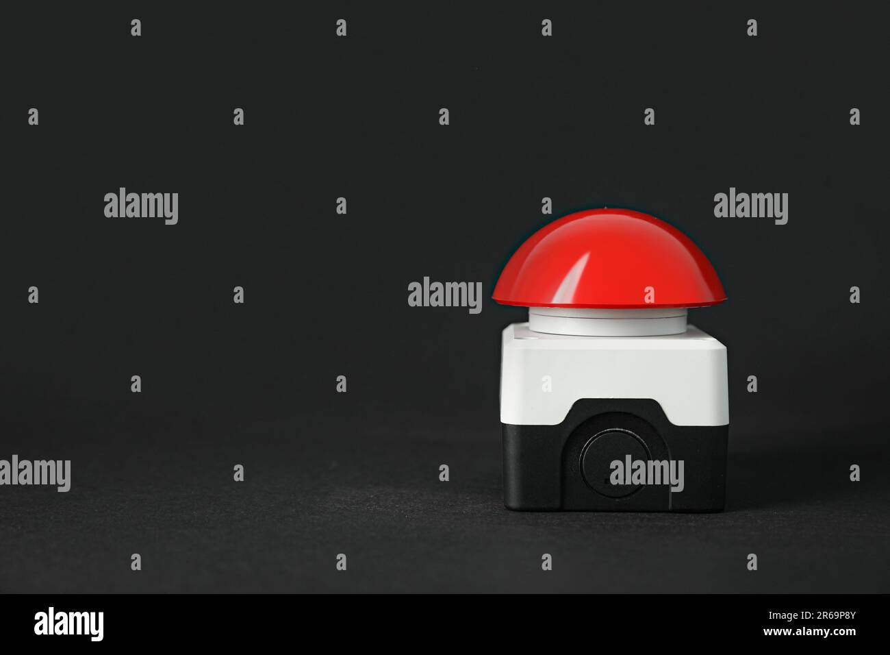 Red button of nuclear weapon on black background, space for text. War ...