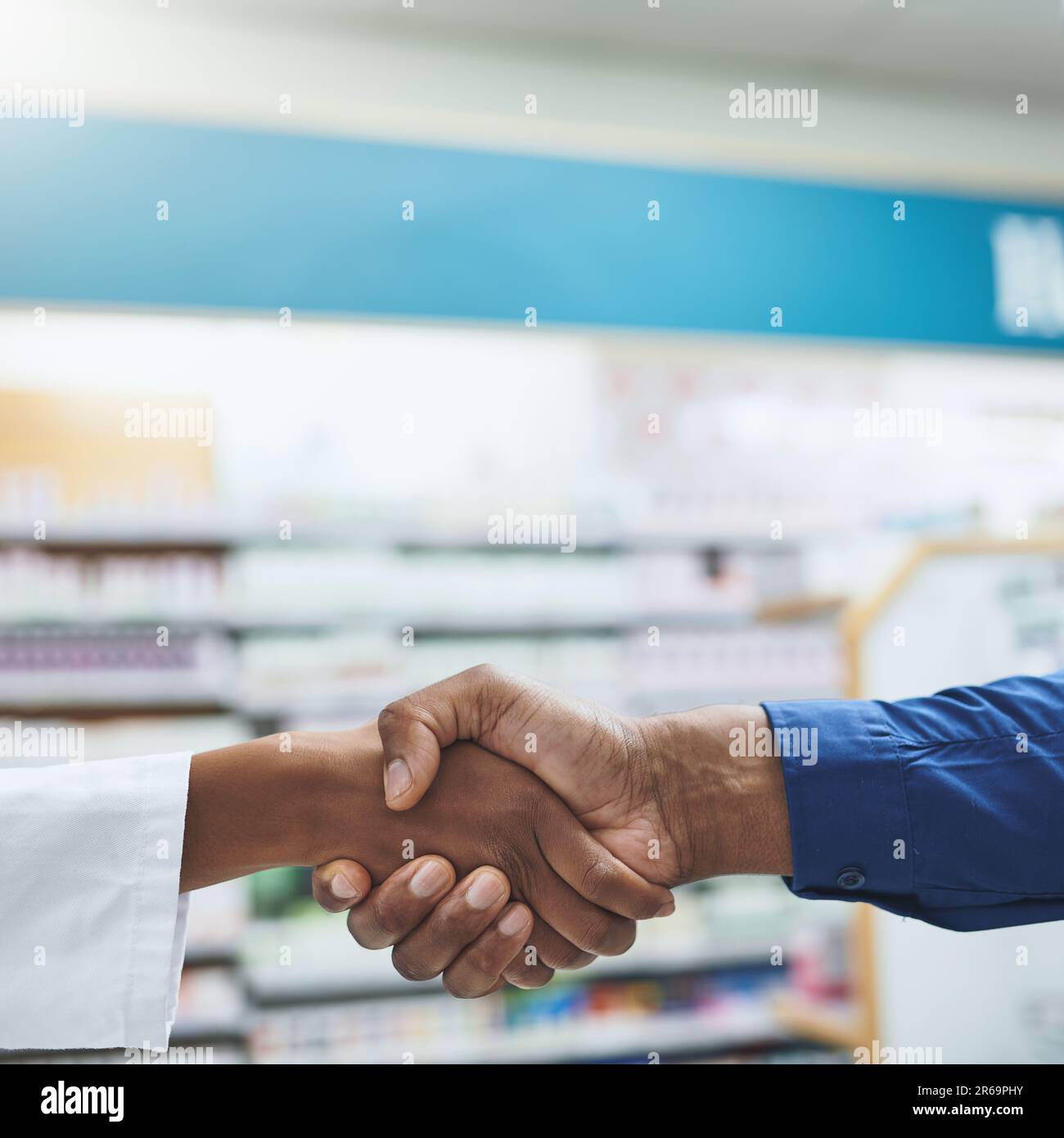 Its a life changing relationship. a pharmacist and a customer shaking ...