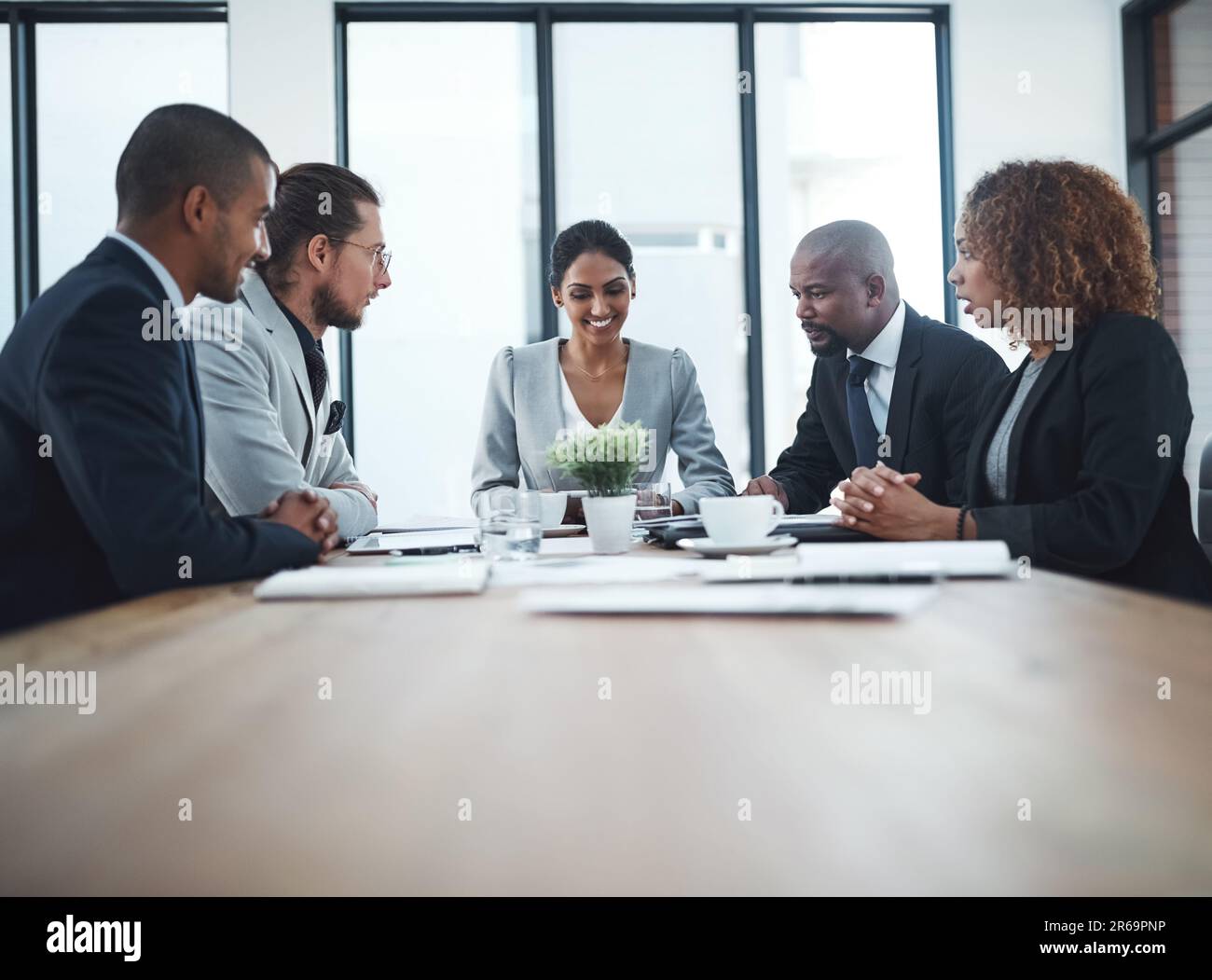 Getting ready to bring their ideas to life. a group of businesspeople ...