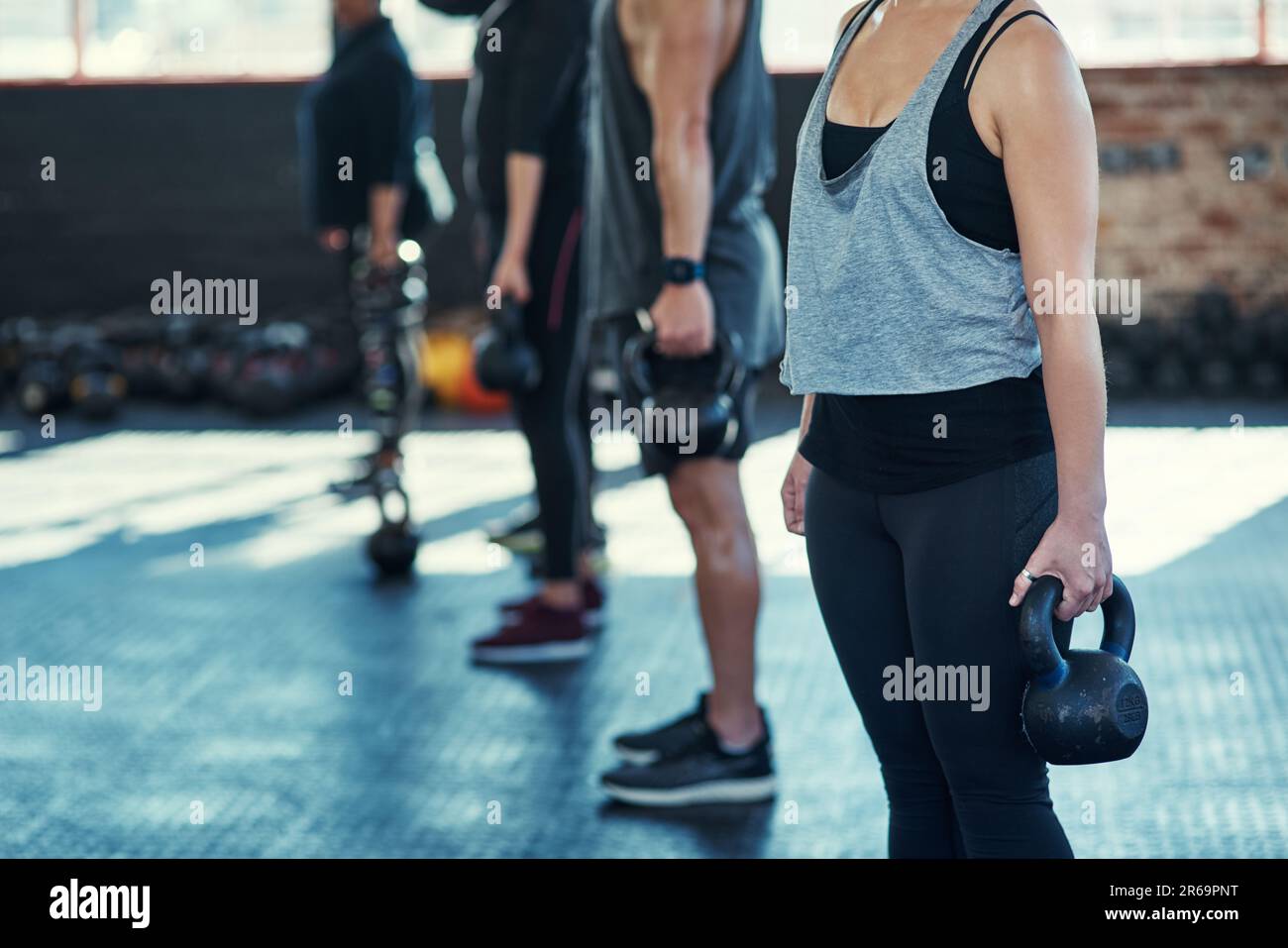 Work those muscles. a group unrecognizable people standing in a row ...