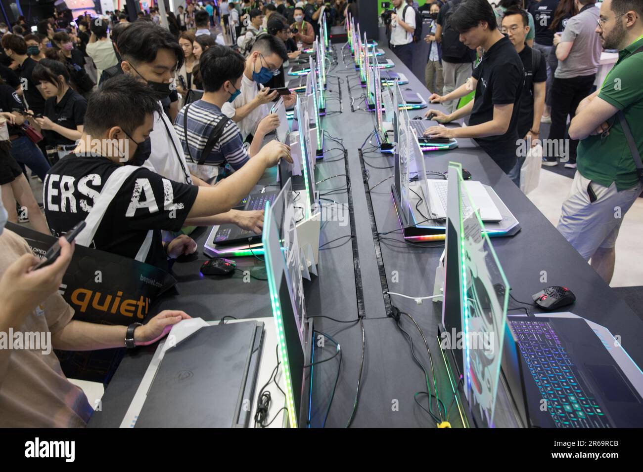 Visitors try MIS notebook at Computex ,a computer and technology trade ...