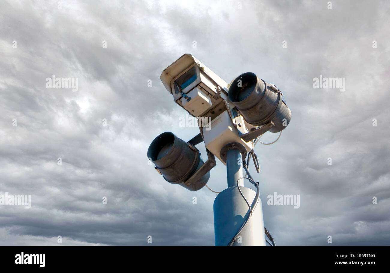 looking up at isolated CCTV security camera with infrared lights, big ...