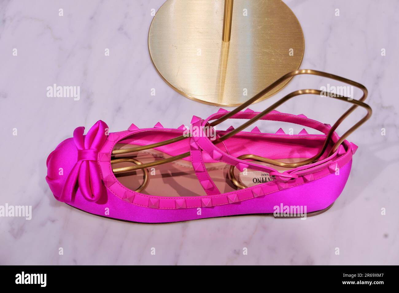 VALENTINO SHOE ON DISPLAY INSIDE THE FASHION STORE Stock Photo - Alamy