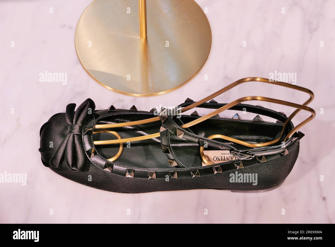 VALENTINO SHOE ON DISPLAY INSIDE THE FASHION STORE Stock Photo - Alamy