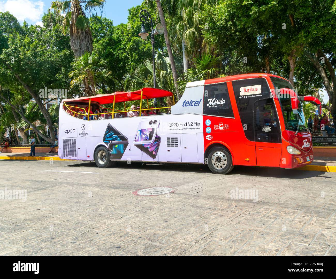 Open topped city tour single decker tourist bus, Plaza Grande, Merida ...