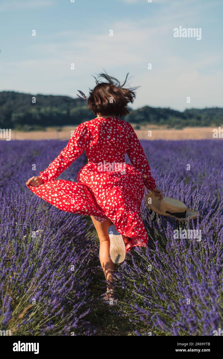 Lady running in flower field hi-res stock photography and images - Alamy