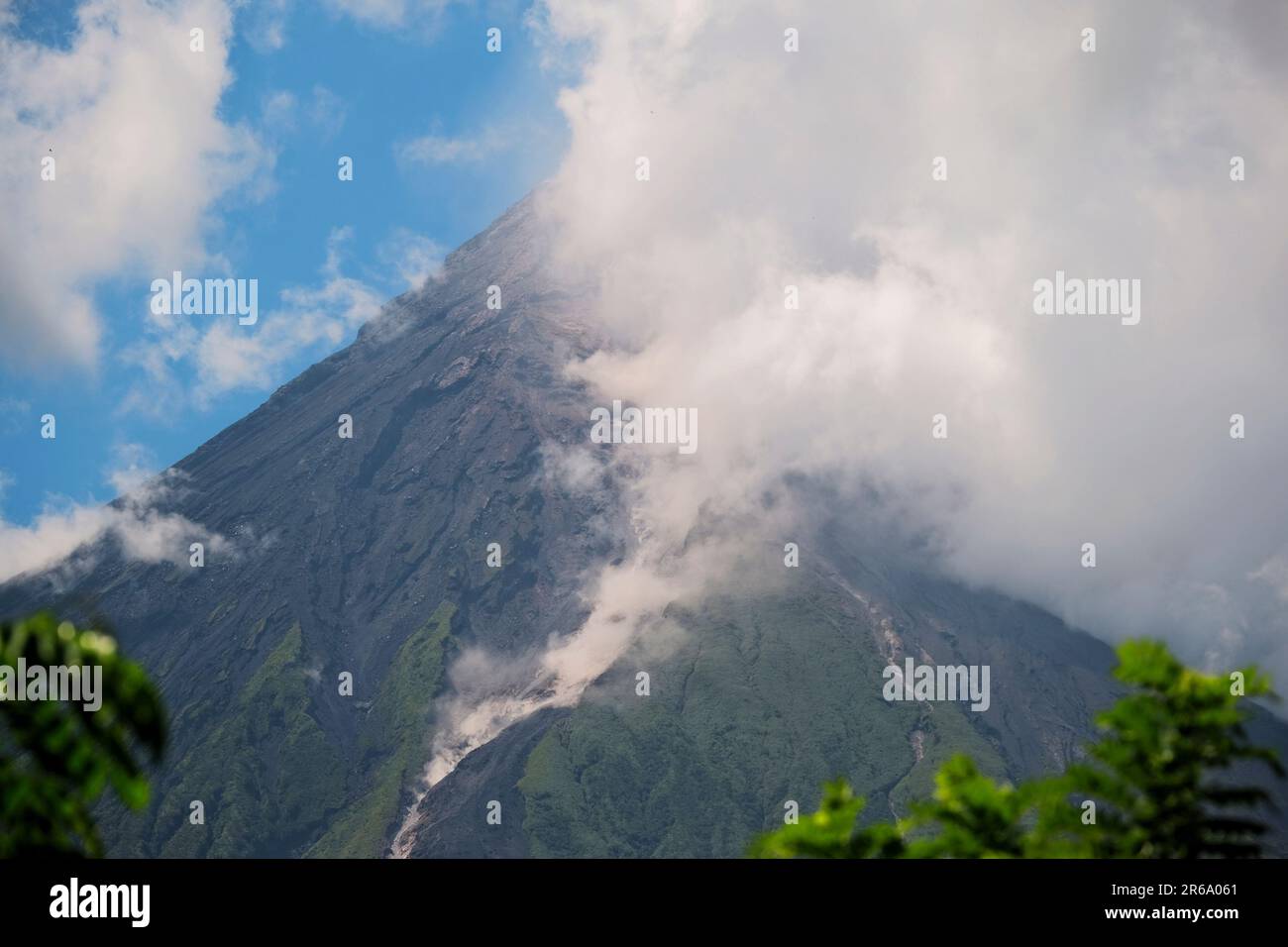 Mayon Volcano spews white smoke as seen from Daraga, Albay province ...