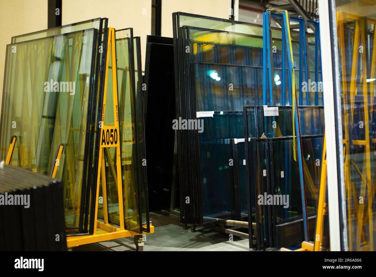 A manufacturing environment producing PVC windows in a factory Stock ...