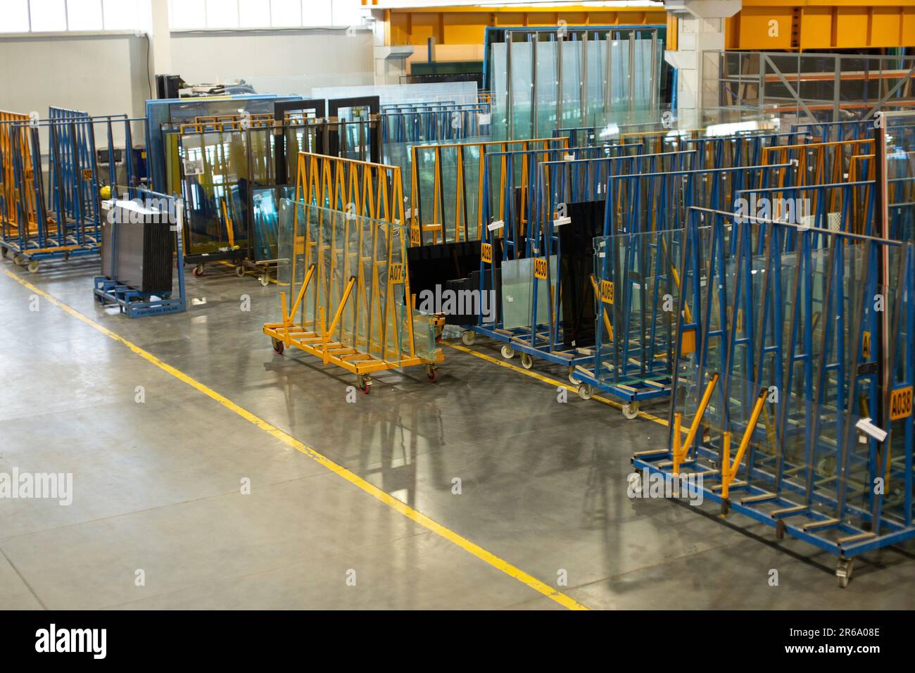 A manufacturing environment producing PVC windows in a factory Stock ...