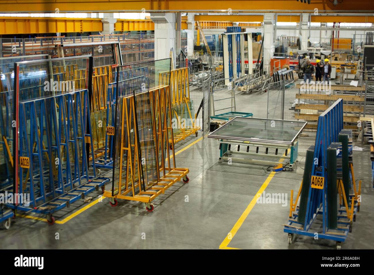 A manufacturing environment producing PVC windows in a factory Stock ...