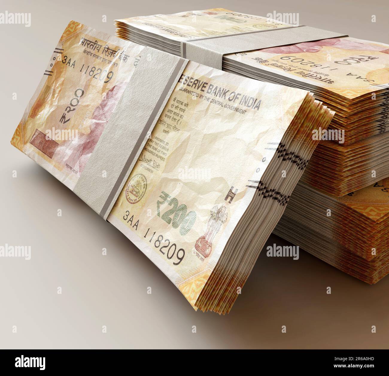 A stack of bundled indian rupee banknotes on an isolated light ...