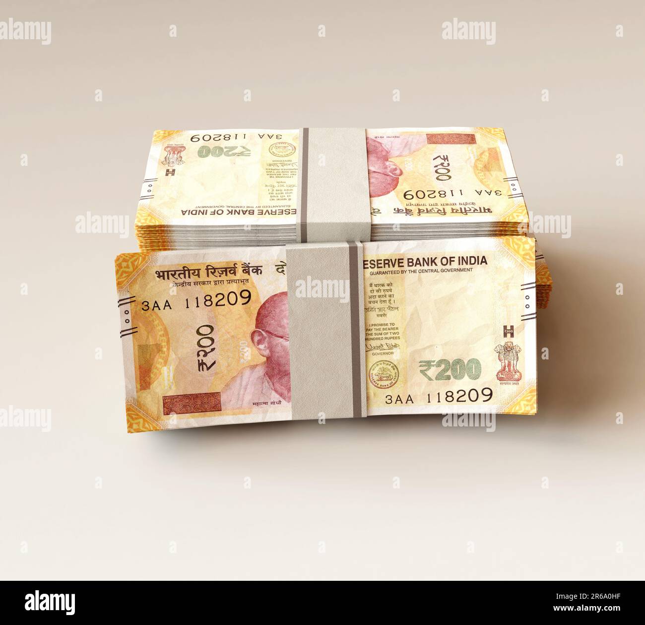 A stack of bundled indian rupee banknotes on an isolated light ...