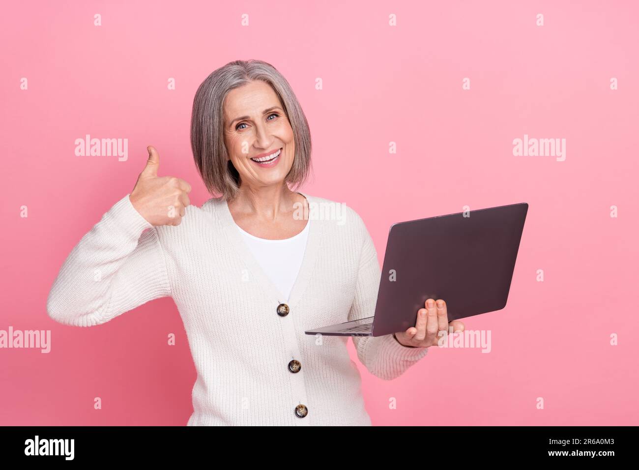 Full length photo of lovely retired lady thumb up netbook apple macbook ...