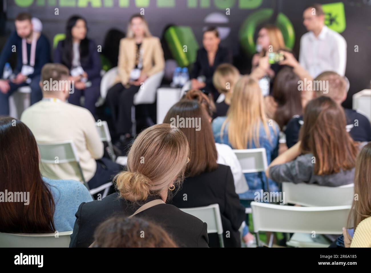 People attending business conference with leading speakers Stock Photo ...