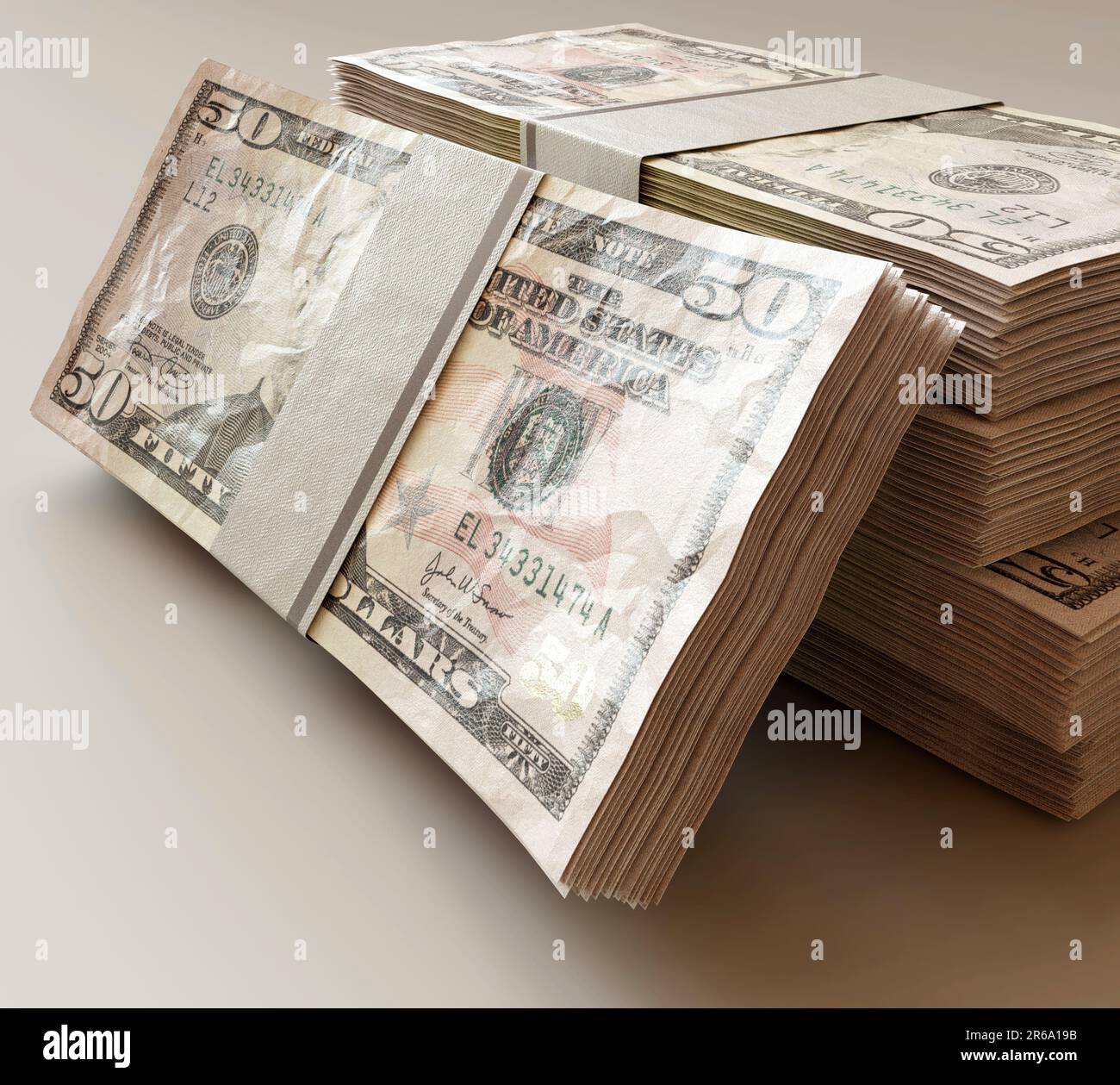 A stack of bundled US dollar banknotes on an isolated light background ...