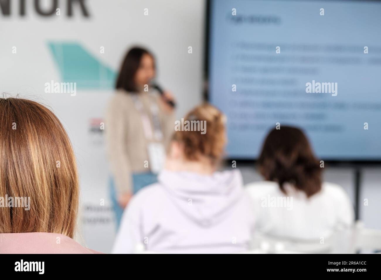 Back view woman listening unrecognizable hi-res stock photography and ...
