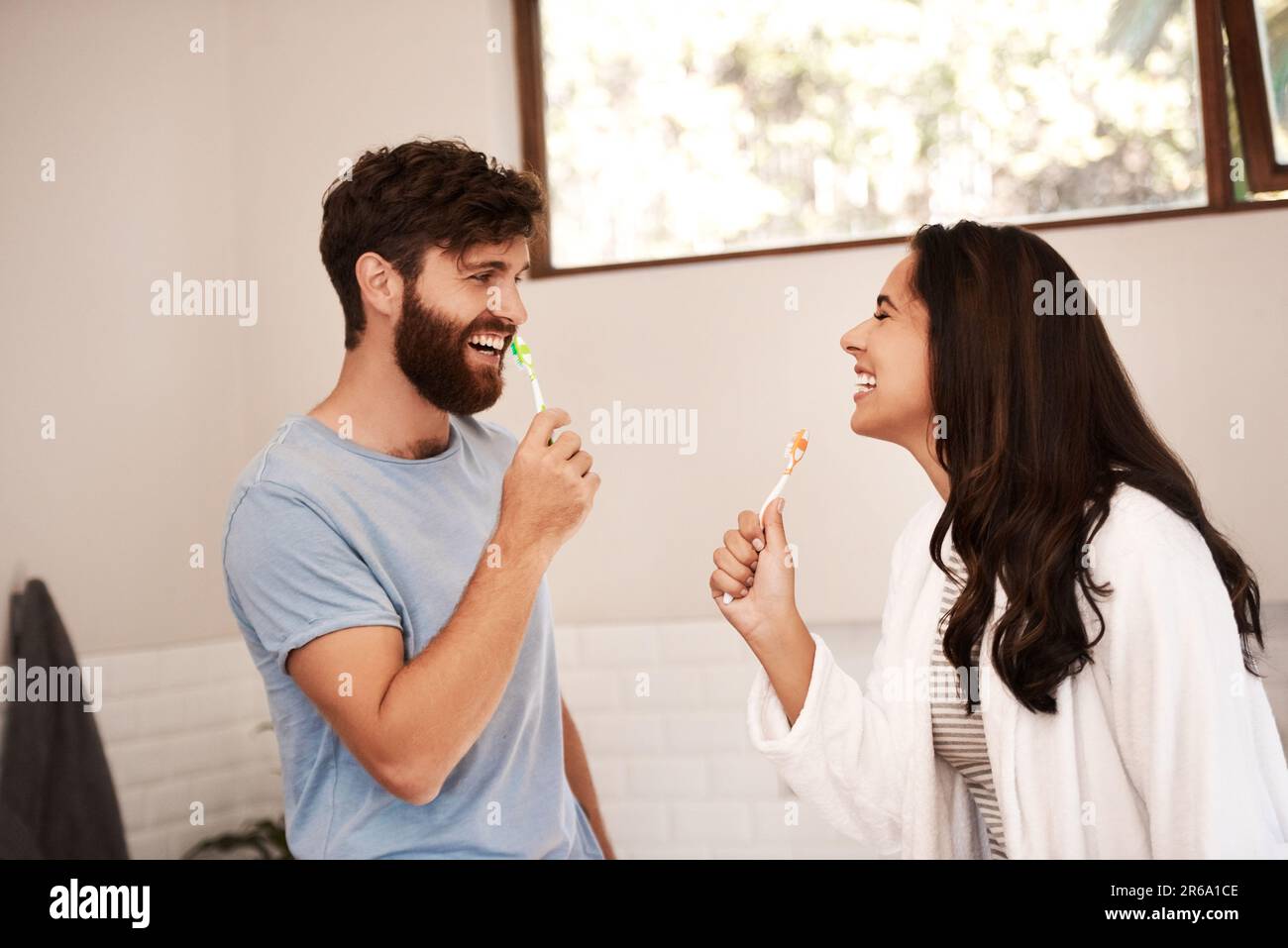 Brushing teeth, home bathroom and happy couple singing music song with ...