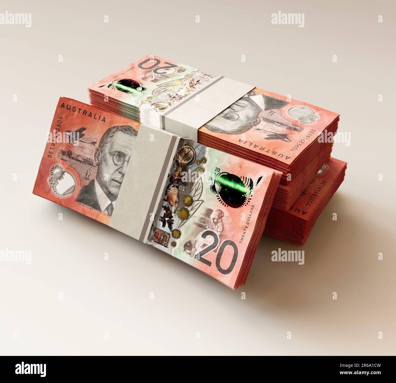 A stack of bundled australia dollar banknotes on an isolated light ...