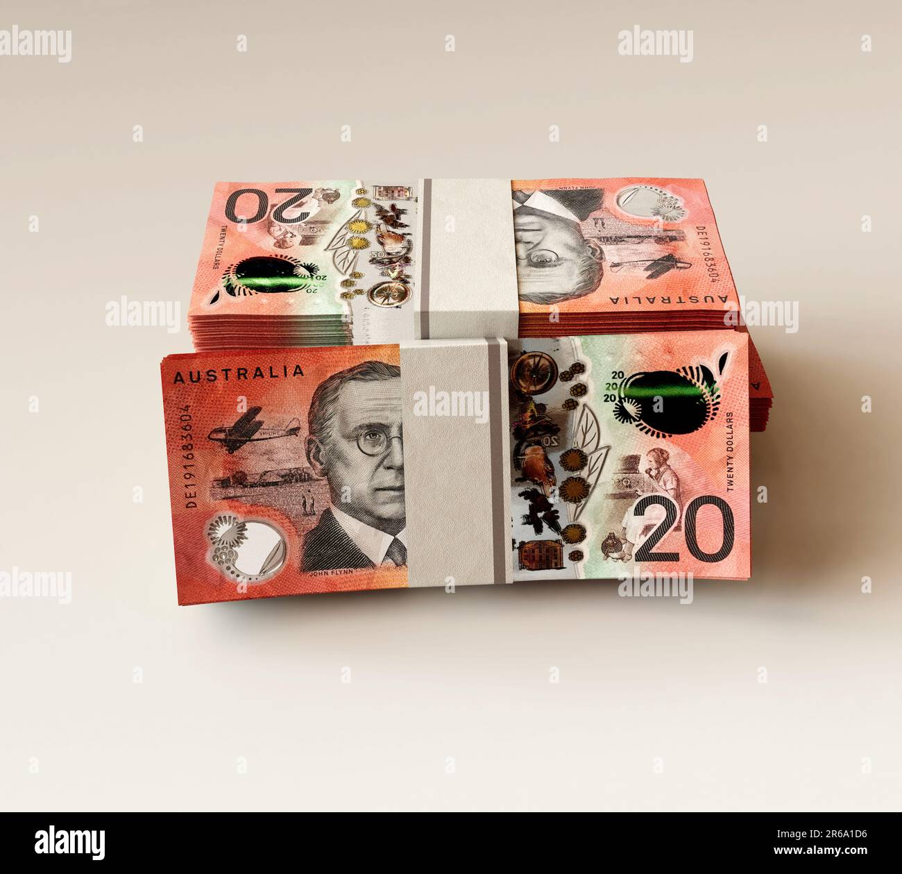 A stack of bundled australia dollar banknotes on an isolated light ...