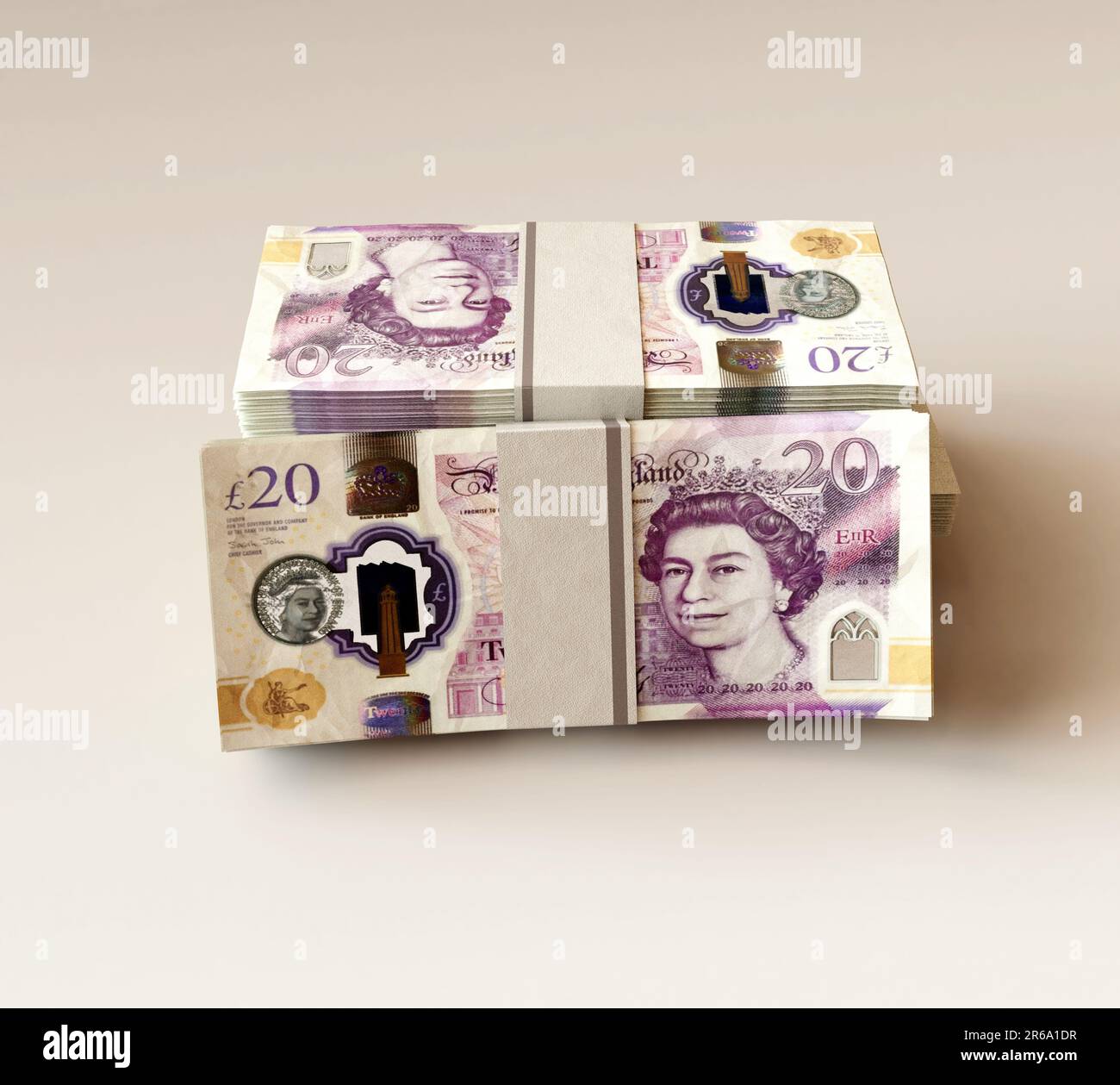 A stack of bundled british pound banknotes on an isolated light ...