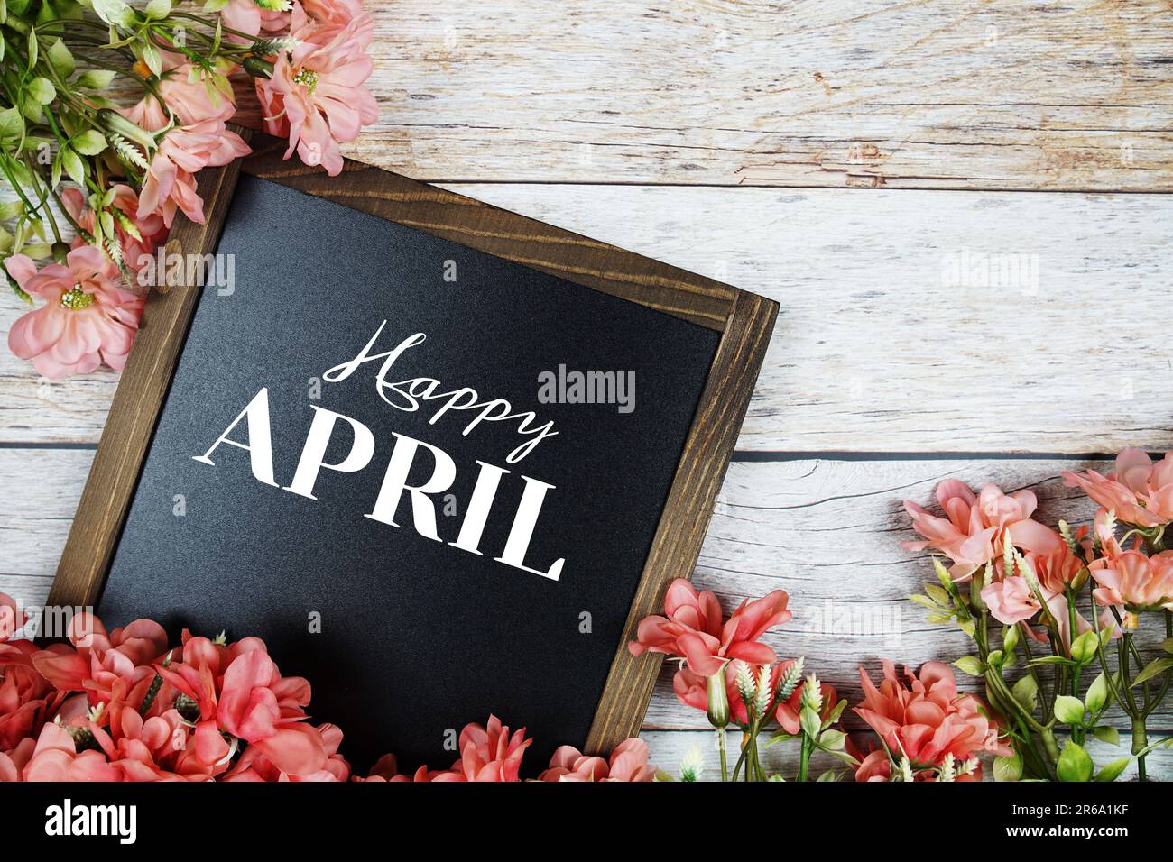Happy April text on blackboard with flower bouquet decoration Stock ...