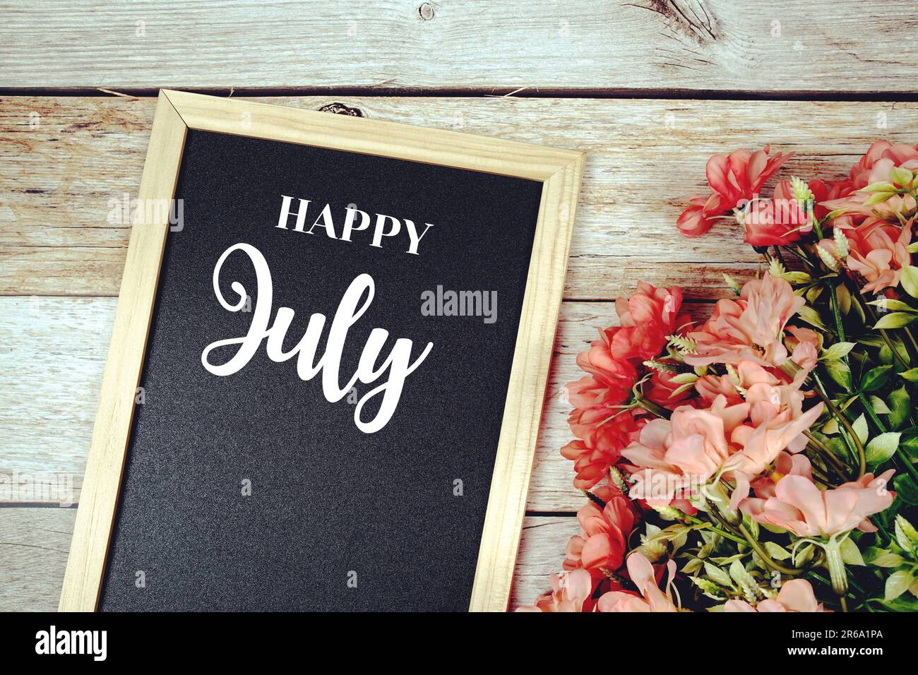 Happy July text on blackboard with flower bouquet decoration Stock ...