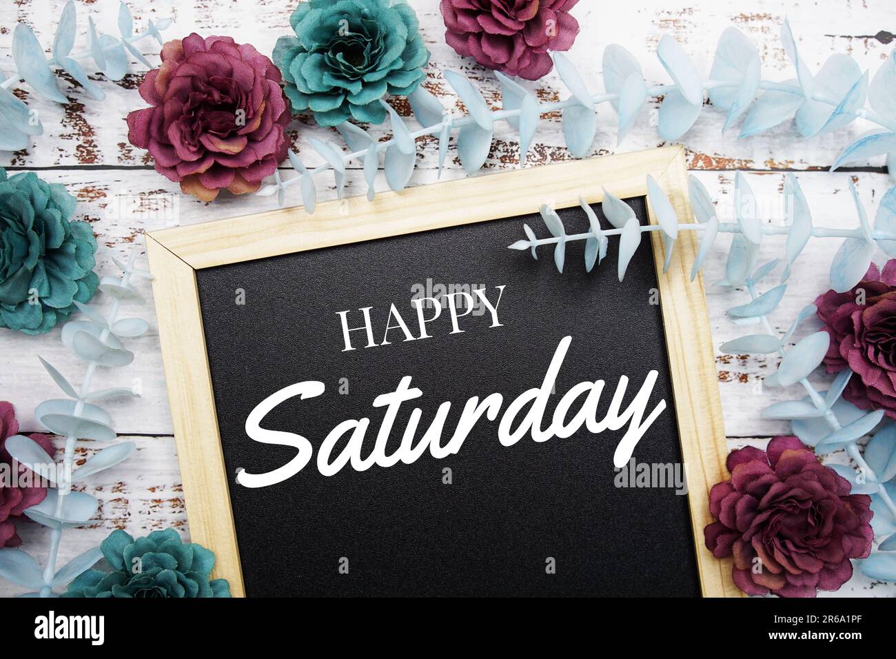 Happy Saturday typography text and flower dcoration on blackboard ...