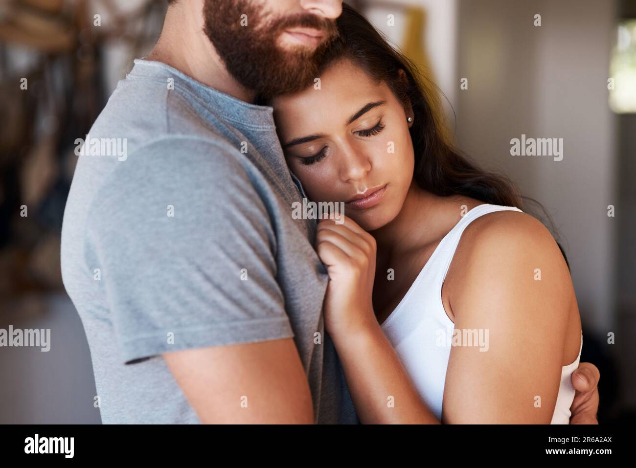 Love, woman and home couple hug for relationship security, safety ...